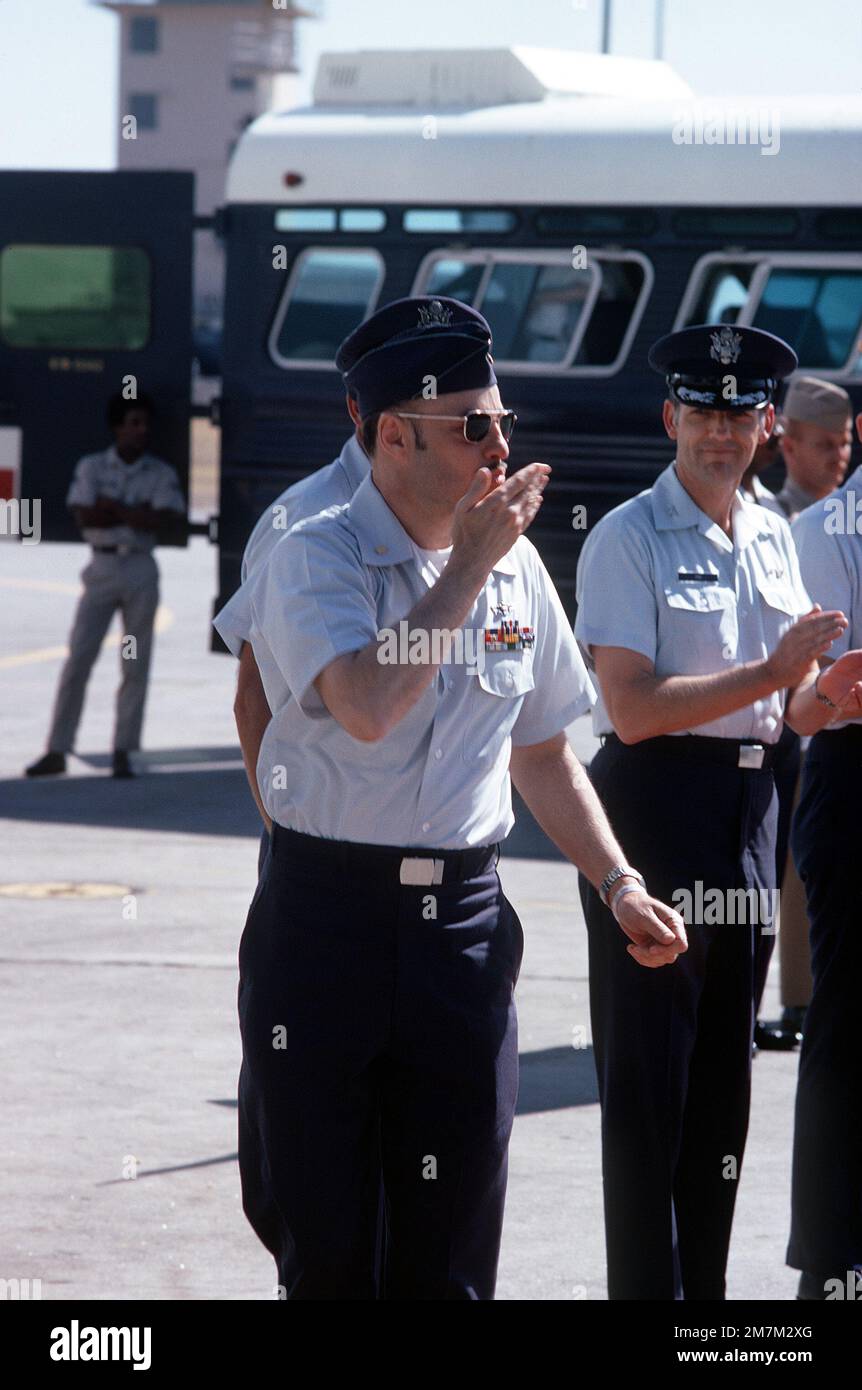Ex-POW and U.S. Air Force MAJ Jay R. Jensen (Captured 18 Feb 67) blows ...