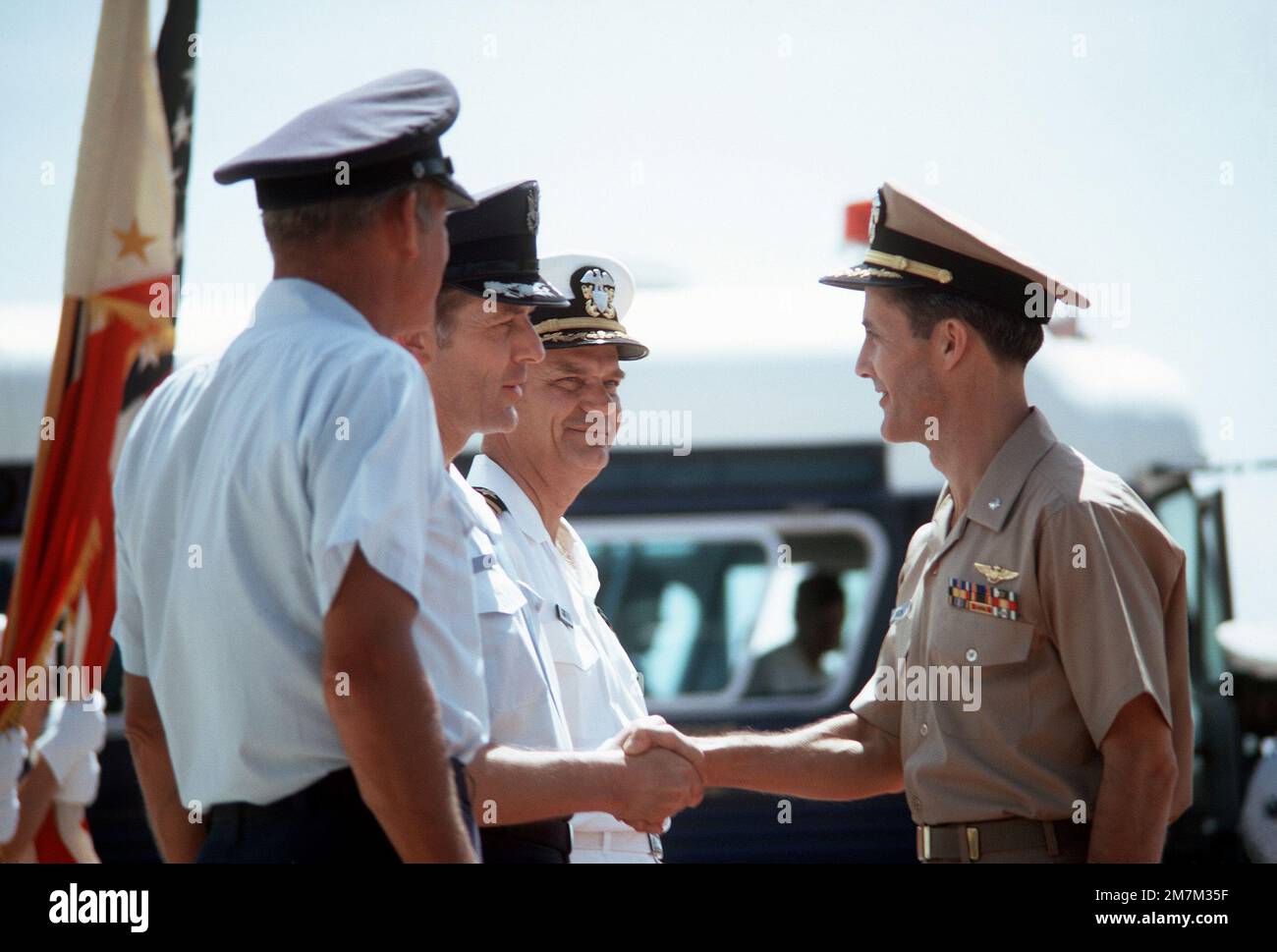 Ex-POW and U.S. Navy LCMDR Edward H. Martin (Captured 19 Jul 67) shakes ...