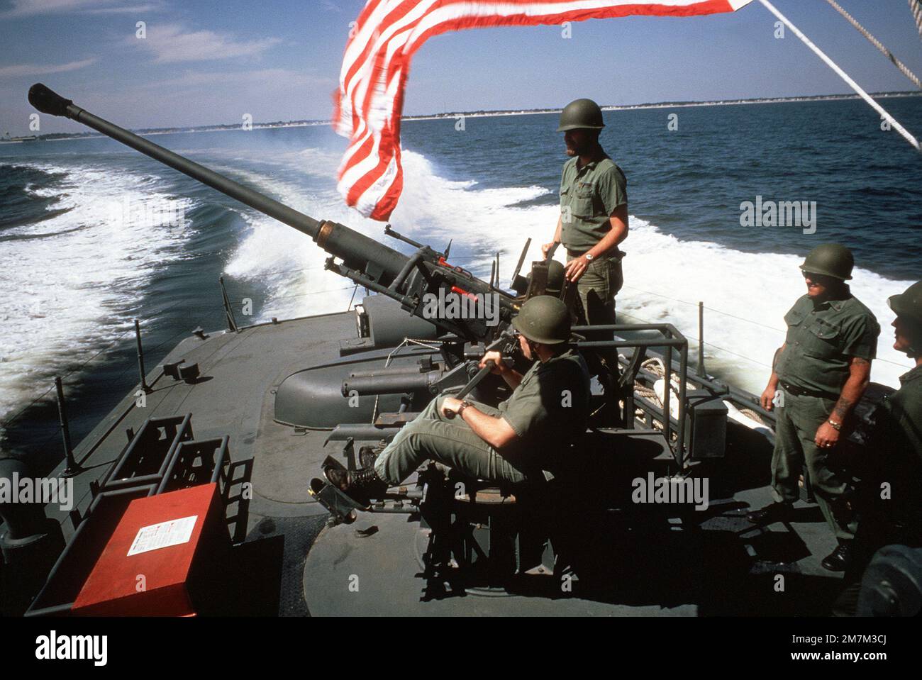 Crew members man a 40mm Bofors gun on a PTF. Country: Unknown Stock ...
