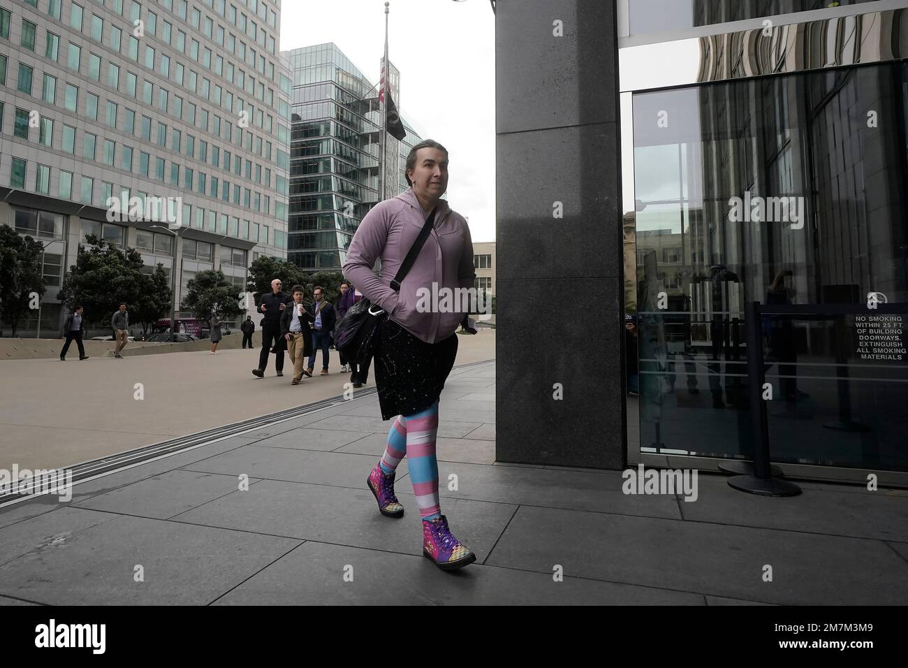 Former Twitter employee Wren Turkal walks toward an entrance to a ...