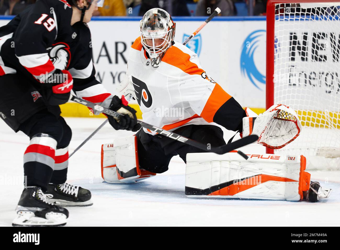 Philadelphia Flyers goaltender Samuel Ersson, right, makes a save ...