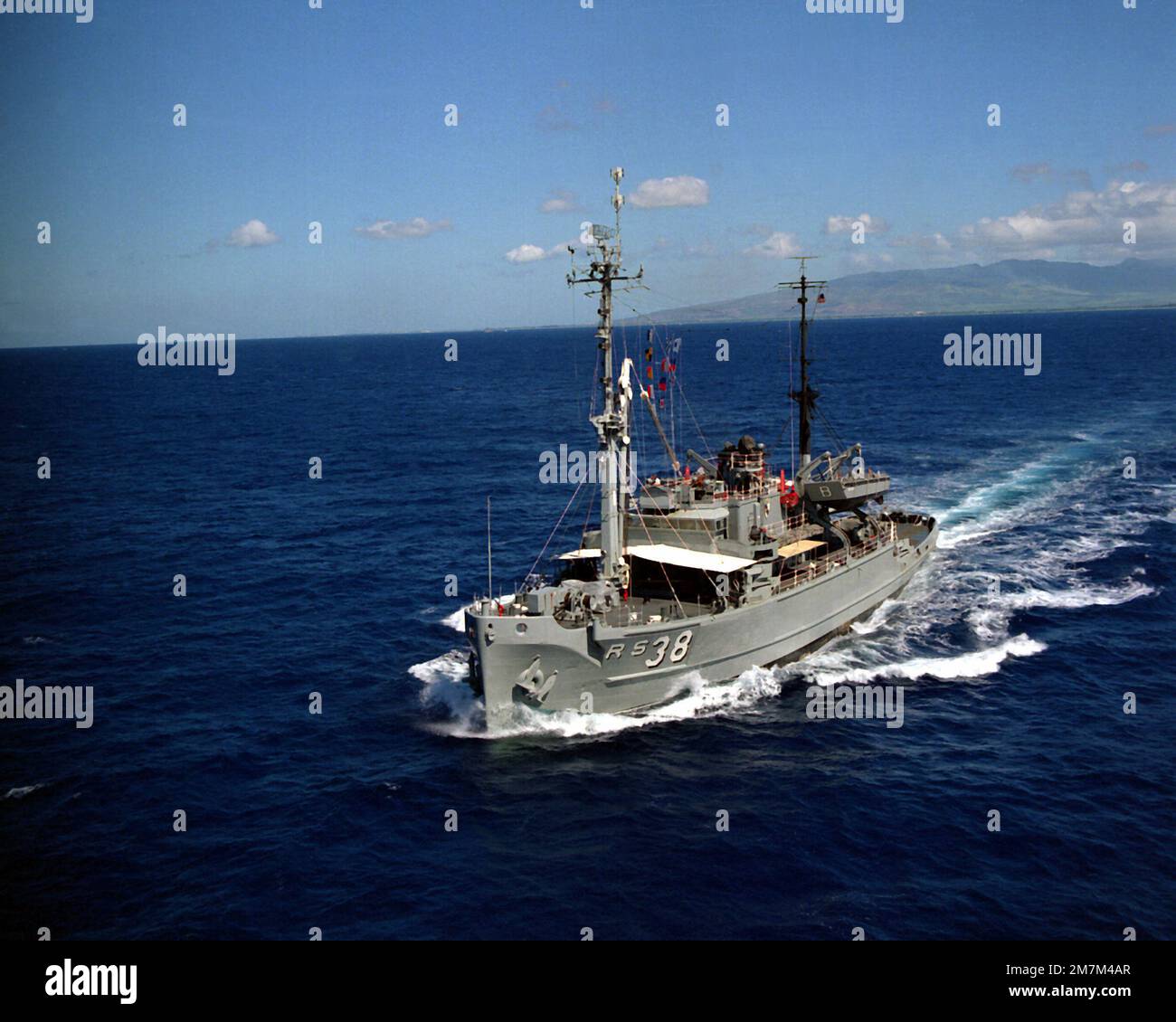 An aerial port bow view of the salvage ship USS BOLSTER (ARS-38 ...