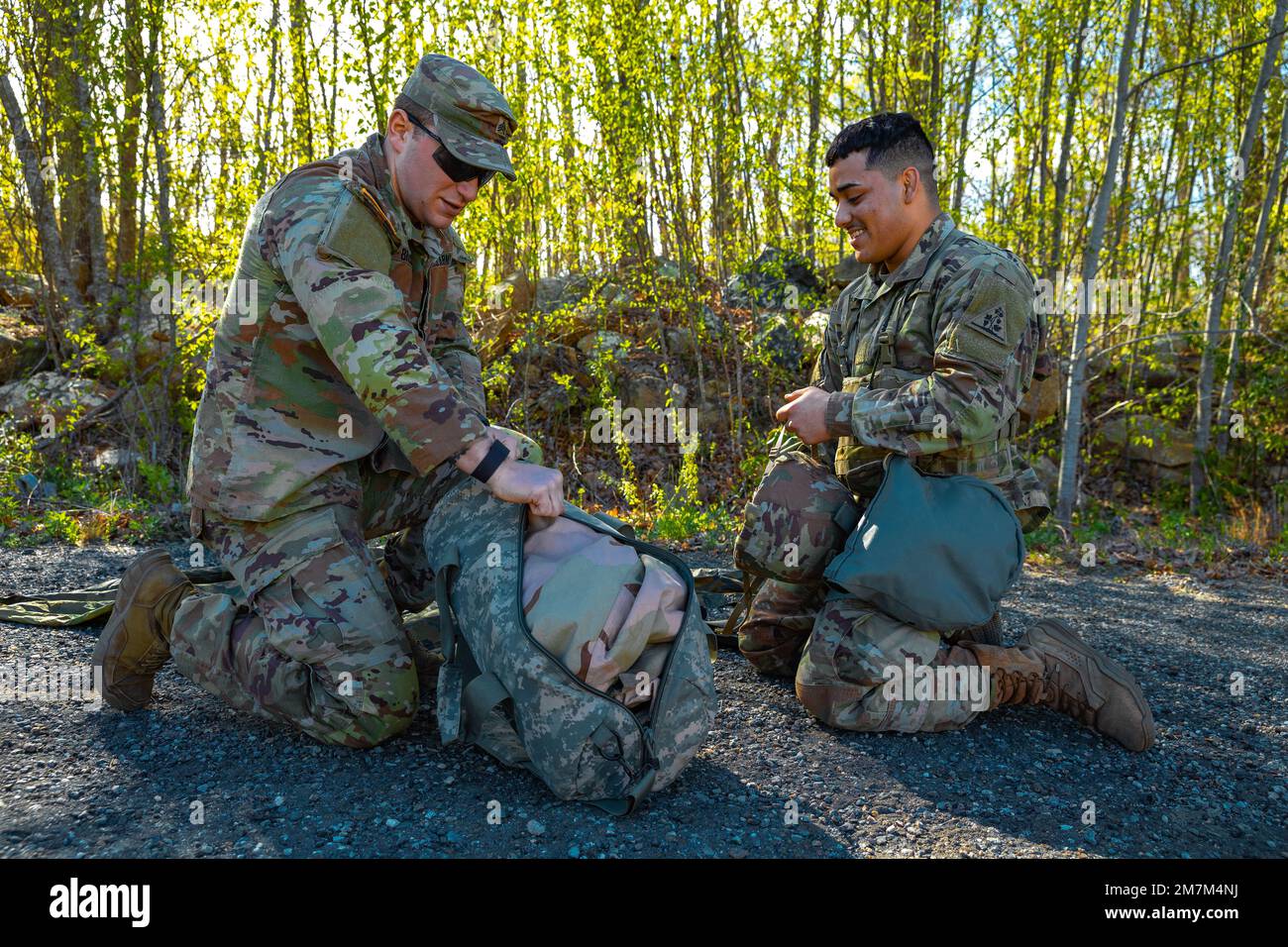 U.S. Army Sgt. Joseph Brachas, left, an infantryman assigned to the 102nd Infantry Regiment ...