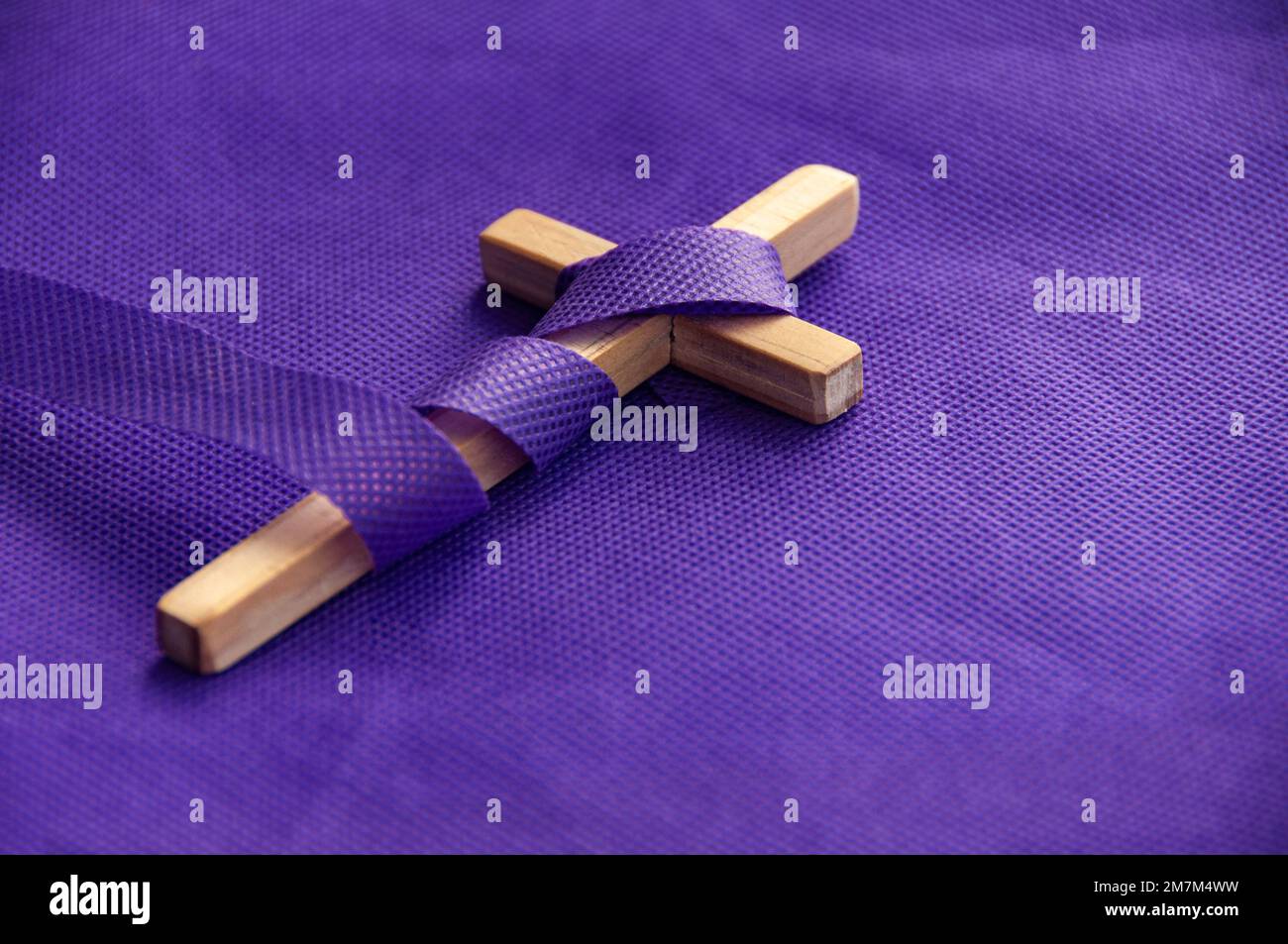 Wooden cross wrapped with maroon cloth. Crucifix and resurrection ...