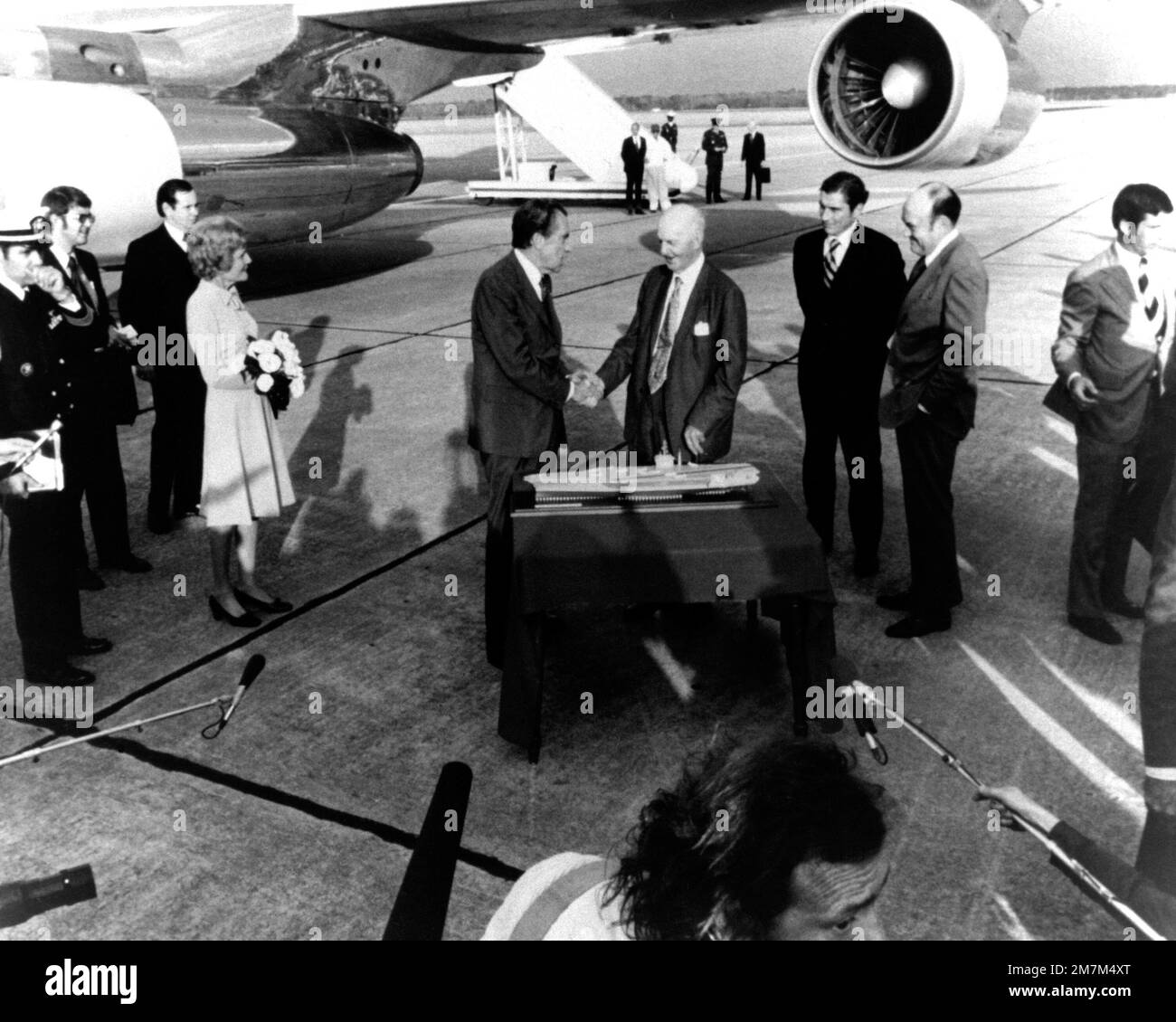 President Richard Nixon, left, shakes hands with former congressman (D ...