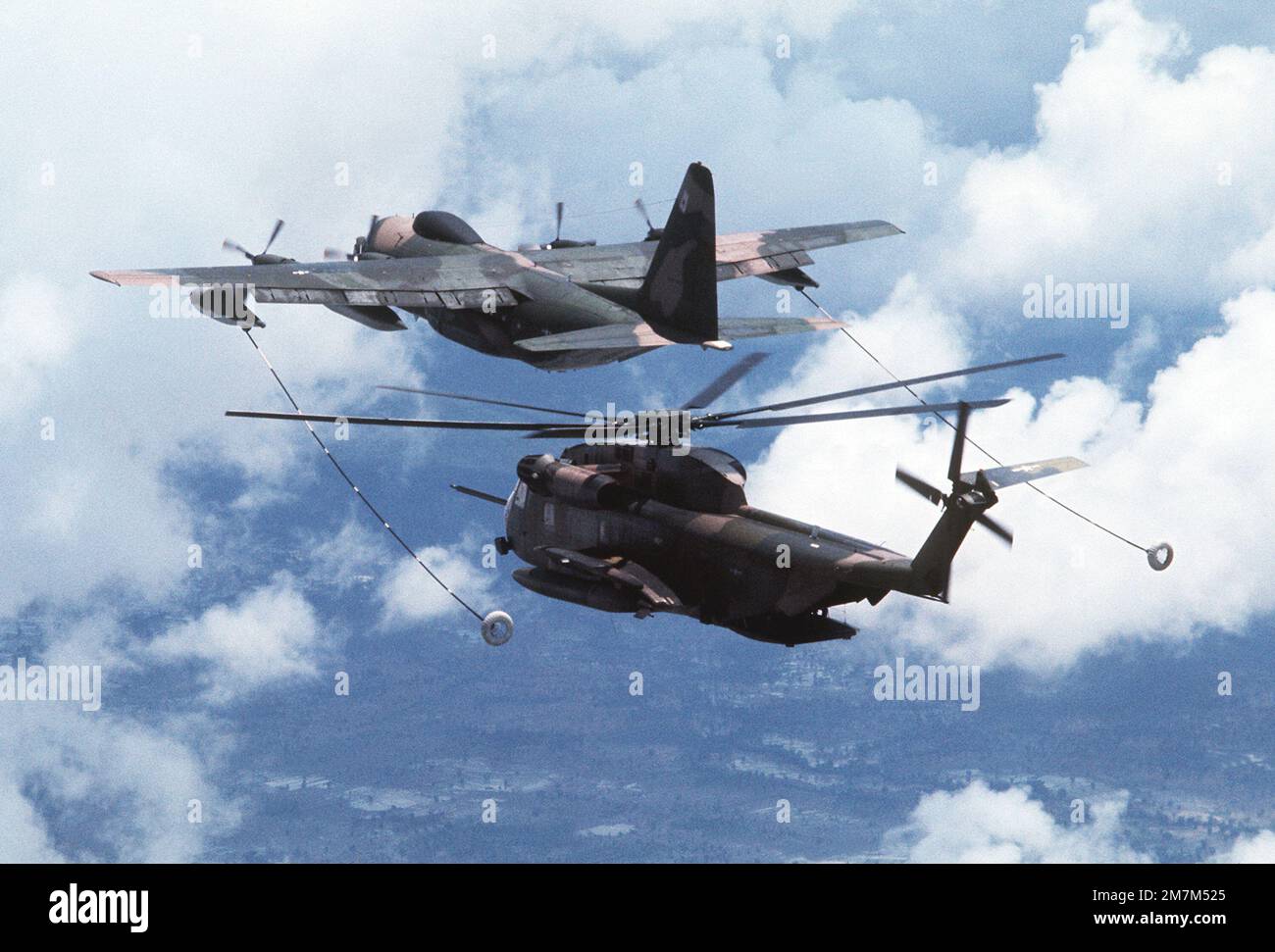 A view of an in-flight HC-130P Hercules aircraft maneuvering to refuel ...