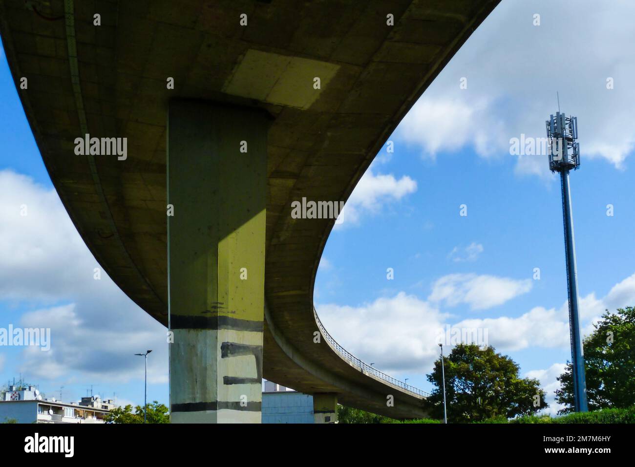 concrete overpass highway underside view. curving high speed road ...