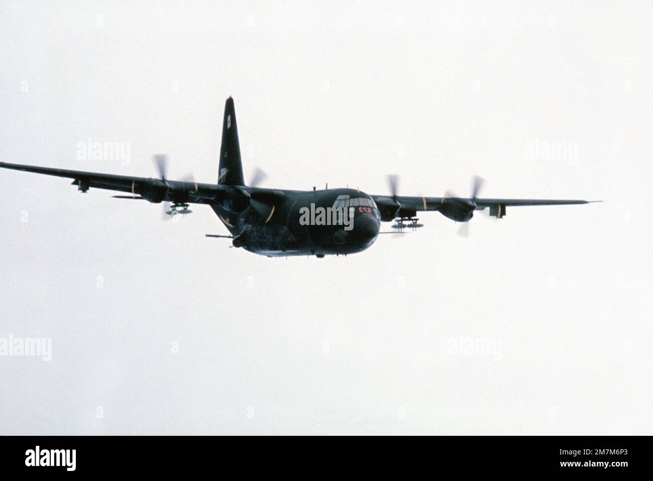A left front view of an AC-130H Hercules aircraft on a training flight ...