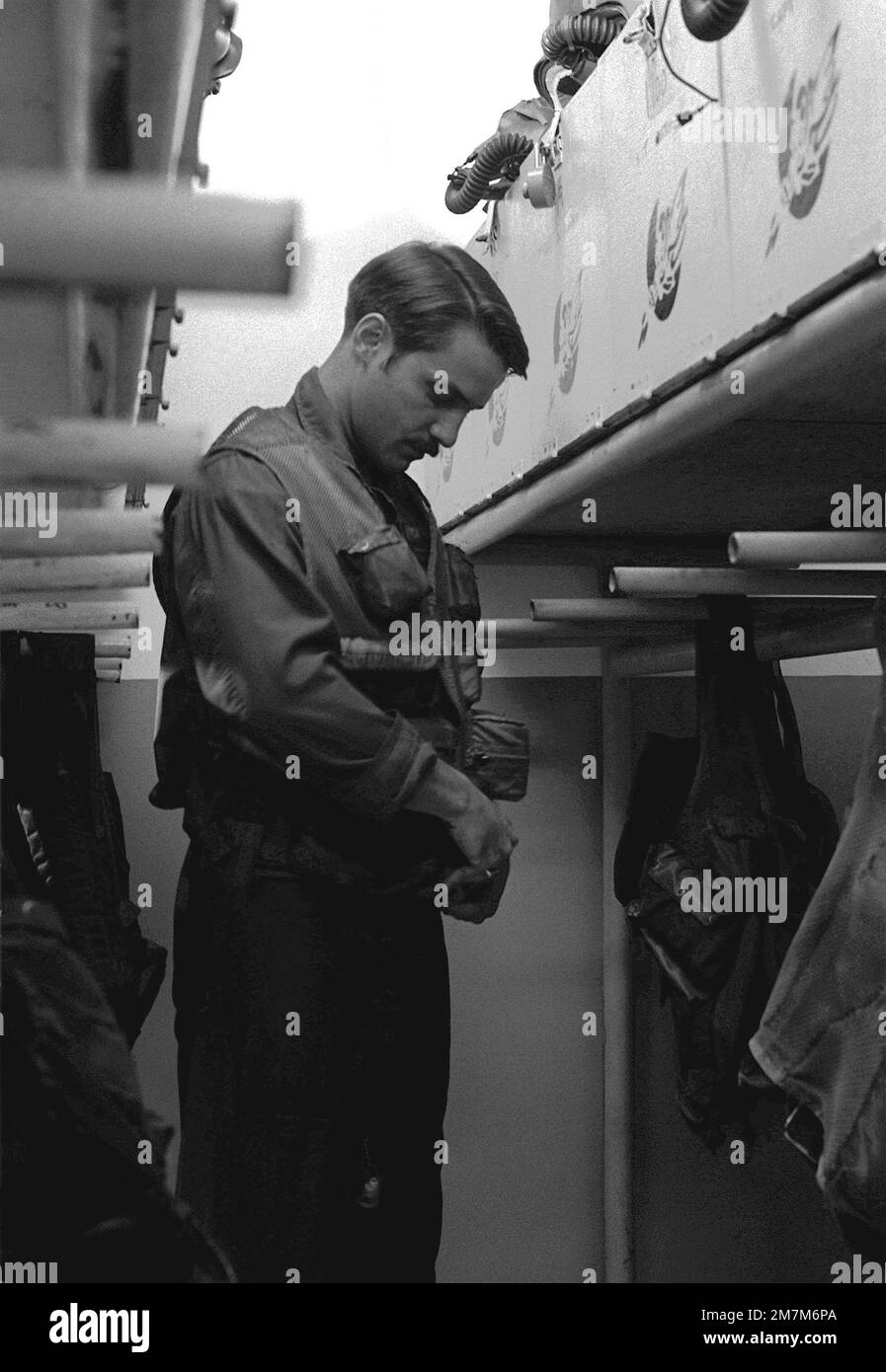 LT Robbie Albright dons his life vest and prepares for an AC-130H ...