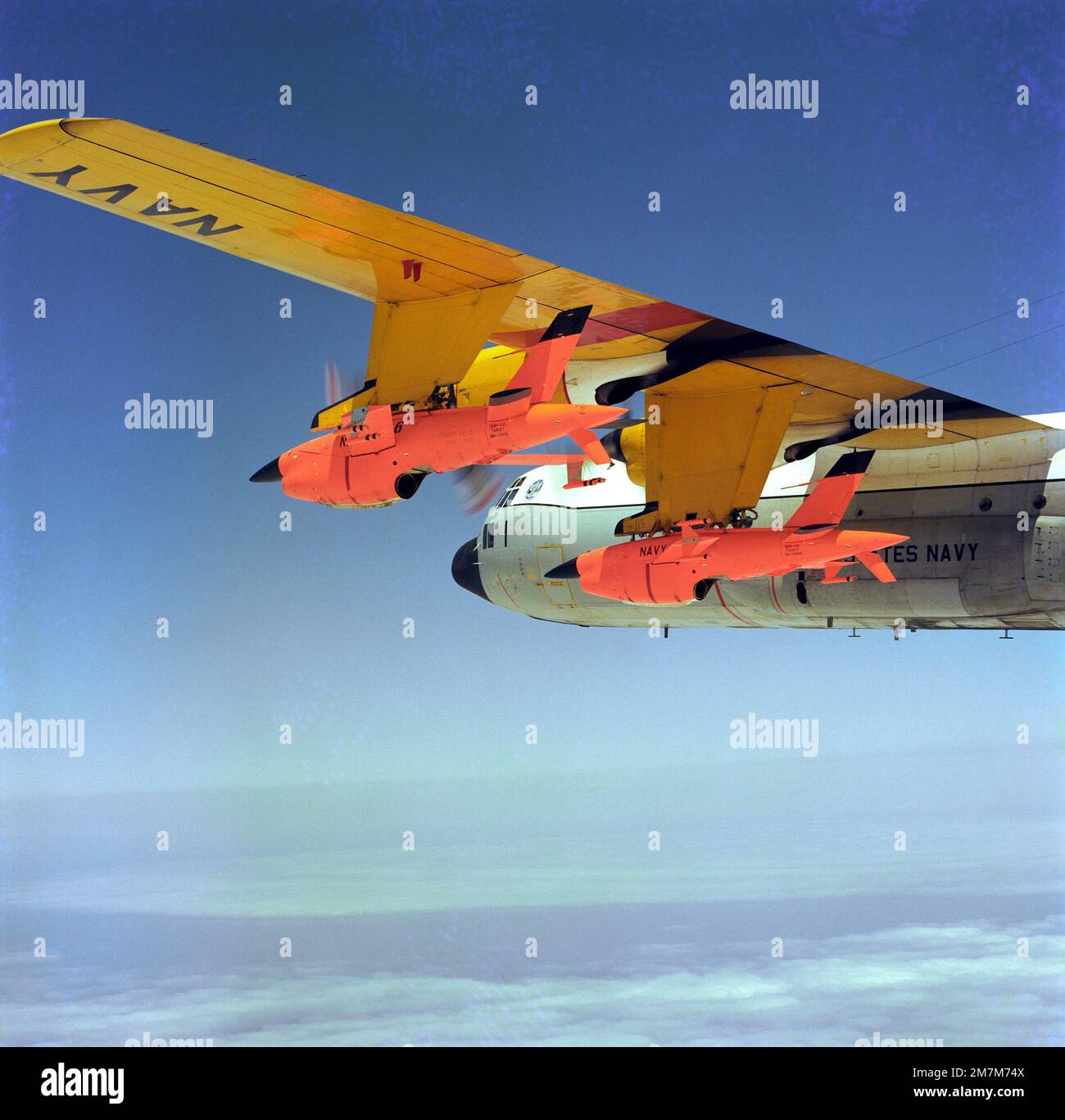 An air-to-air left side view of a DC-130 Hercules drone control ...