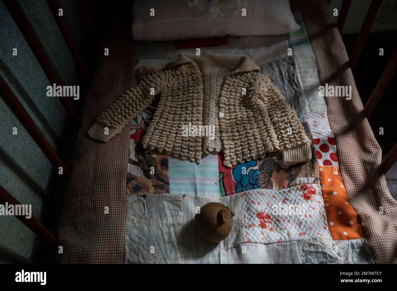 A sweater worn by soccer legend Pele is displayed on his baby crib ...
