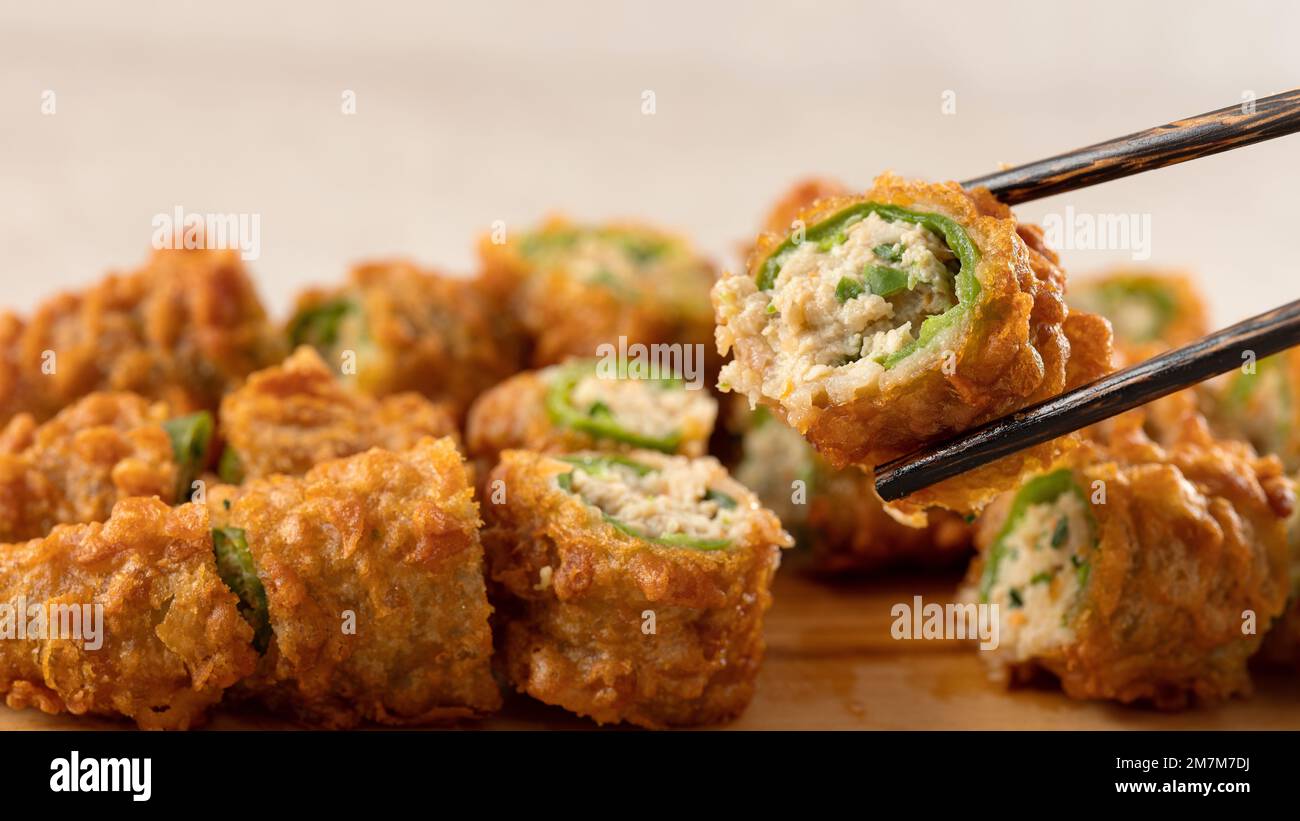 Fried chilli pepper stuffed minced meat and vegetables Stock Photo - Alamy