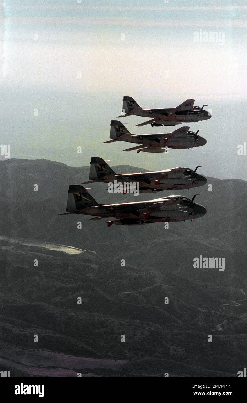 An air-to-air right side view of four A-6A Intruder aircraft in echelon ...