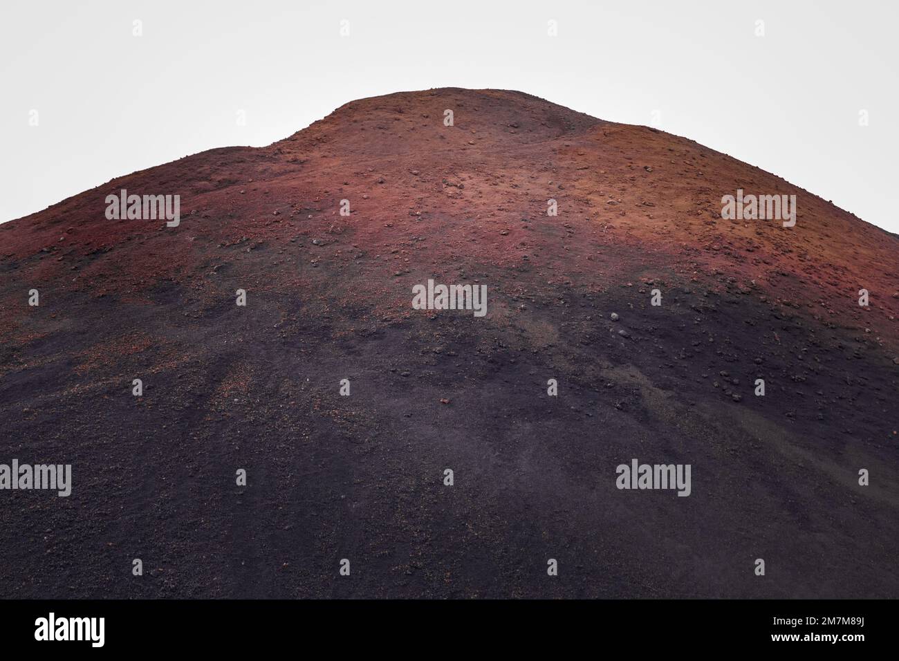 Close-up of the peak with its sandy texture running down the volcano ...