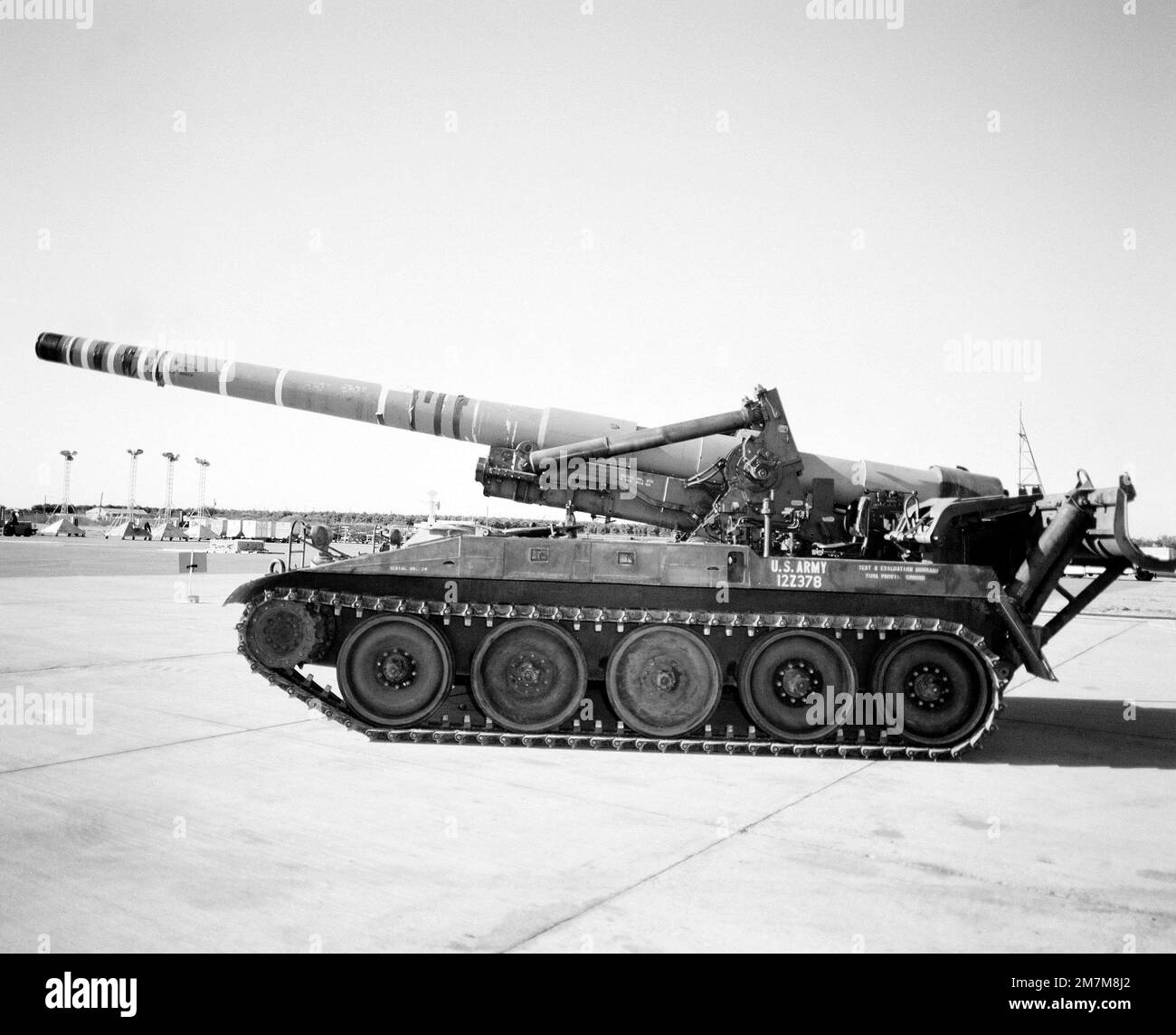 An M-110 203mm self-propelled howitzer is parked on the flight line ...
