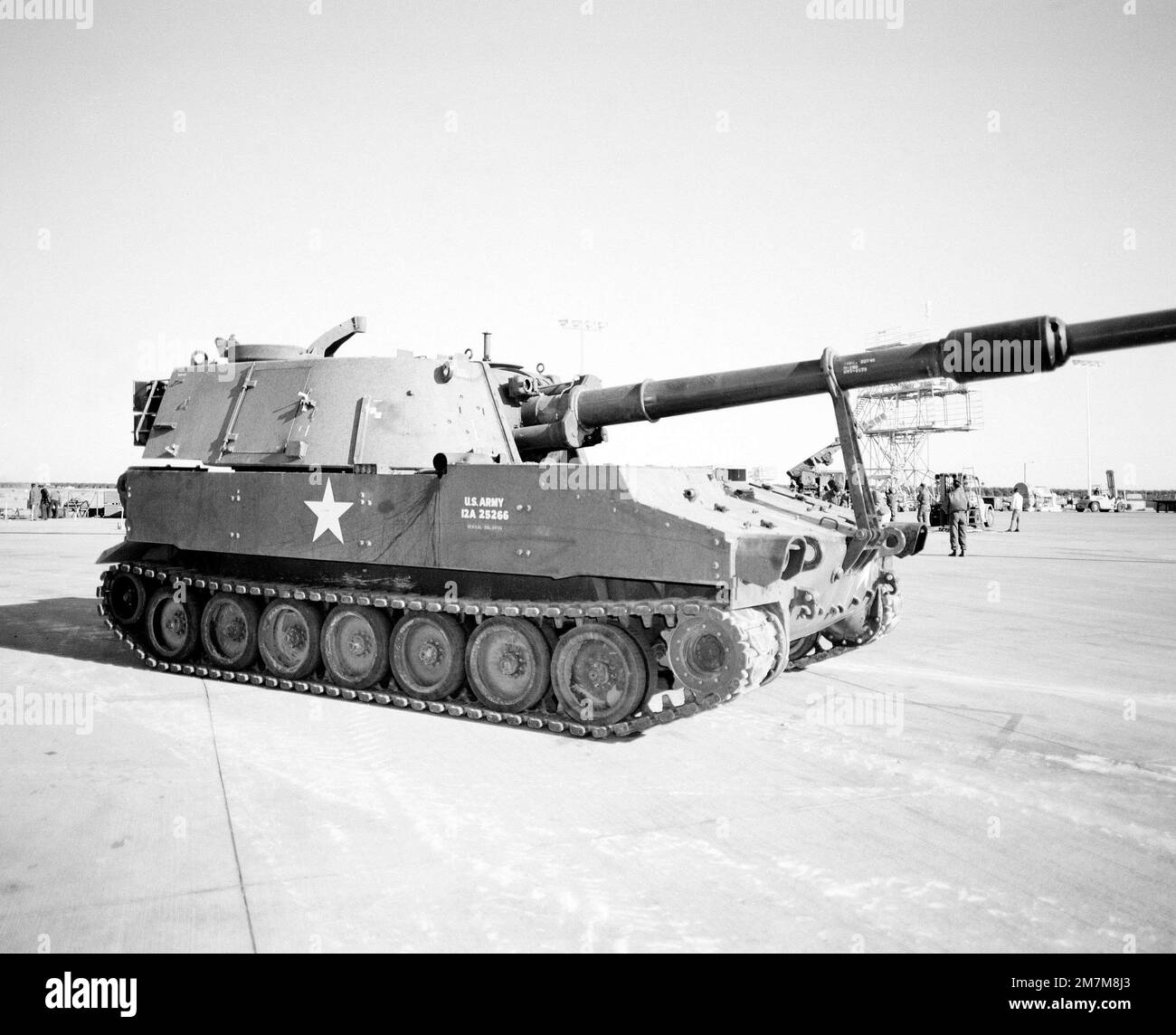 An M-109A1 155mm self-propelled howitzer is parked on the flight line ...