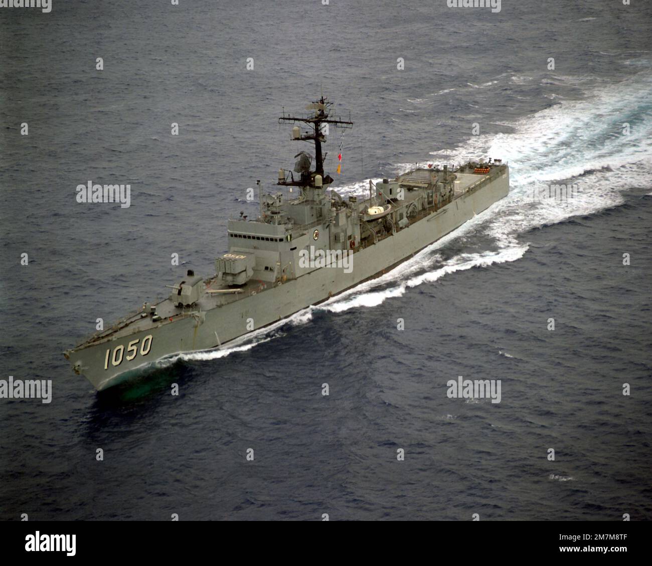An aerial port bow view of the frigate USS ALBERT DAVID (FF-1050 ...