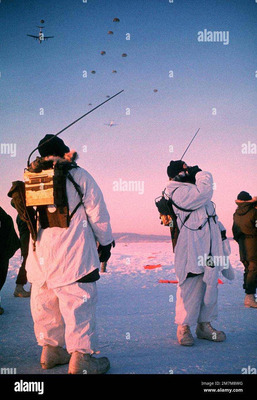 A combat control team, in the drop zone, keeps in radio contact with C ...