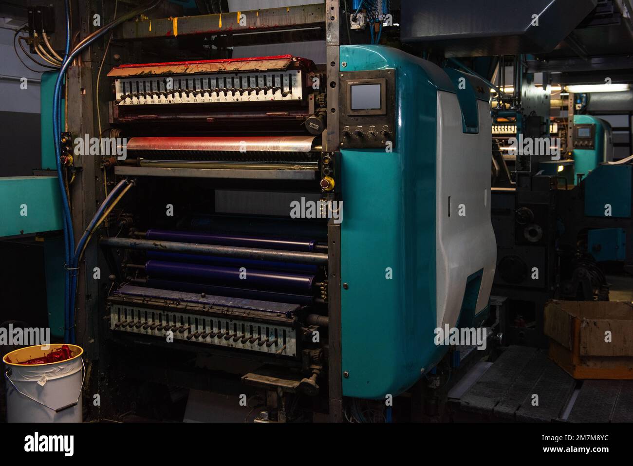 Printing house warehouse interior with printing machine Stock Photo - Alamy