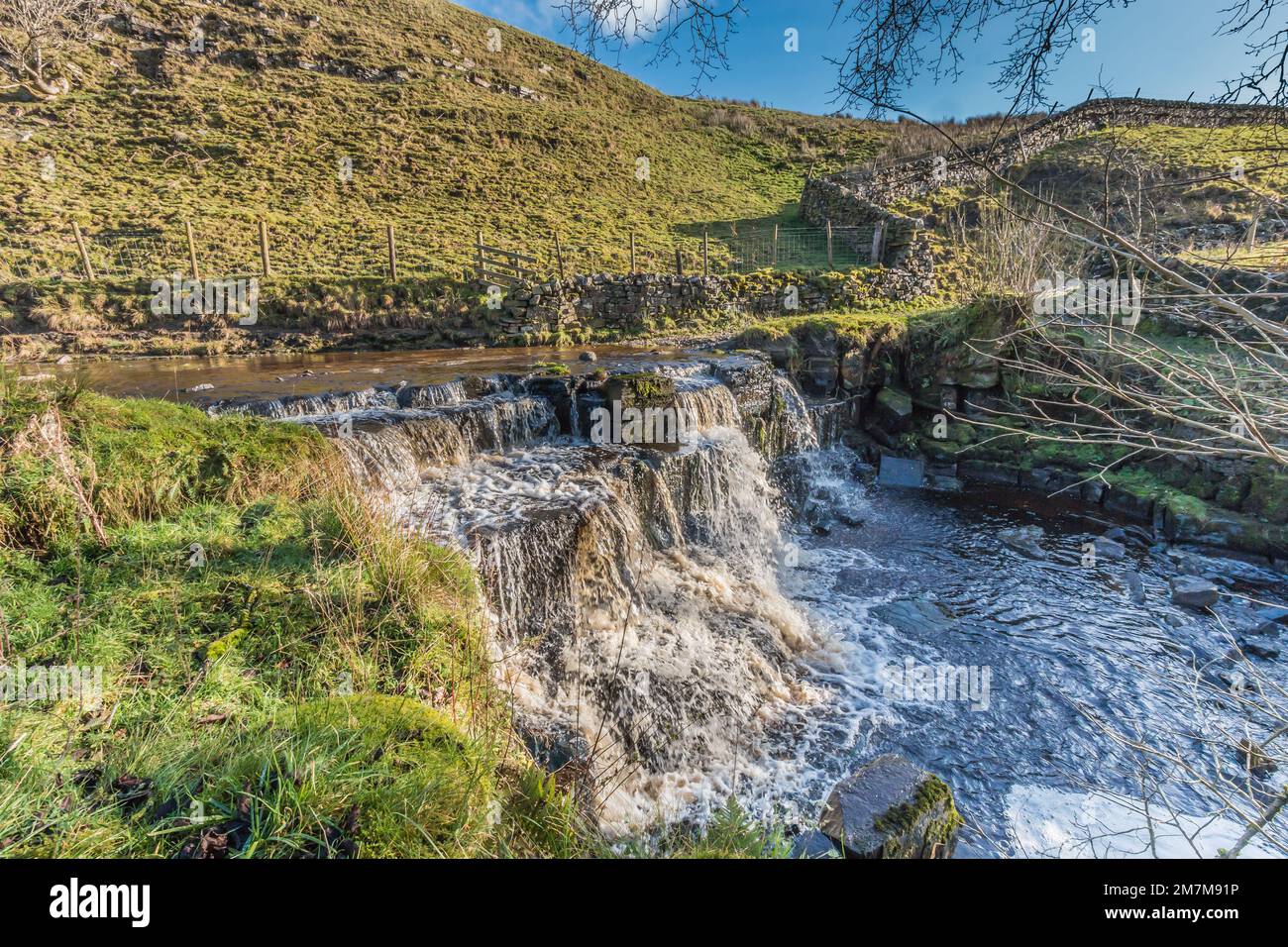 Very strong late autumn sunshine lights up this picturesque waterfall ...