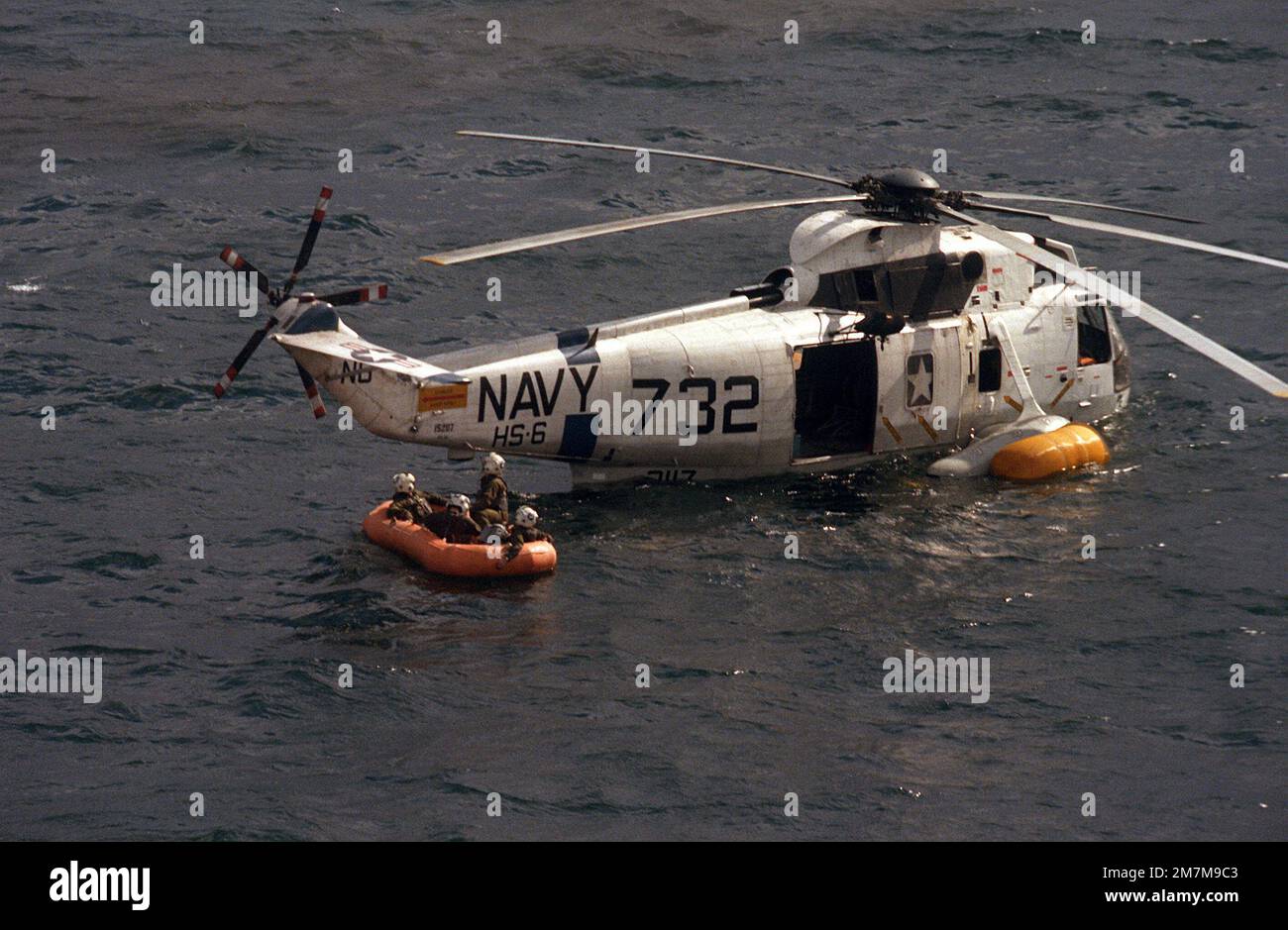 Members of Helicopter Anti-submarine Squadron 6 (HS-6) await rescue ...