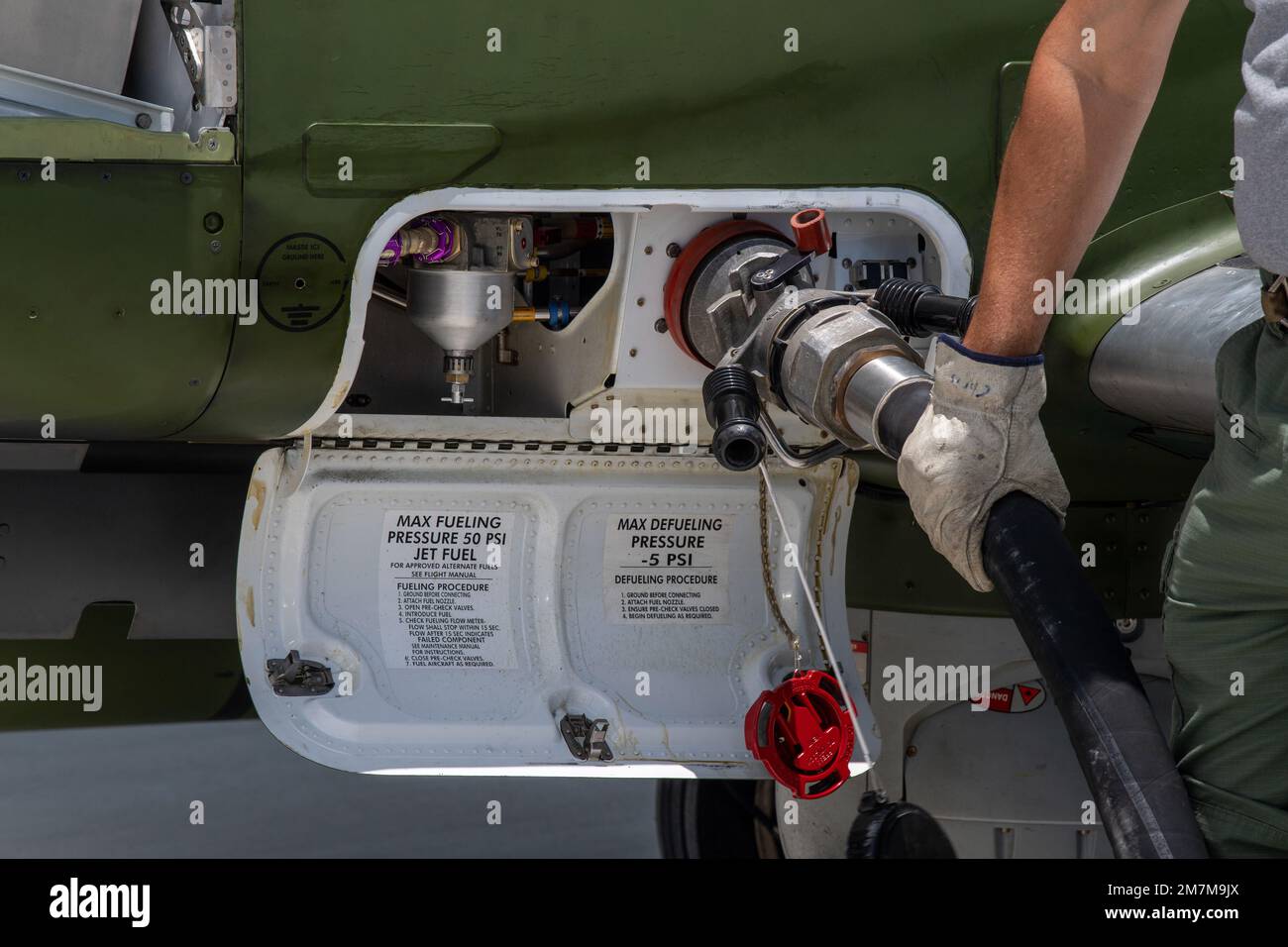 Christopher Cardona, Textron weapons loading technician, refuels an AT ...