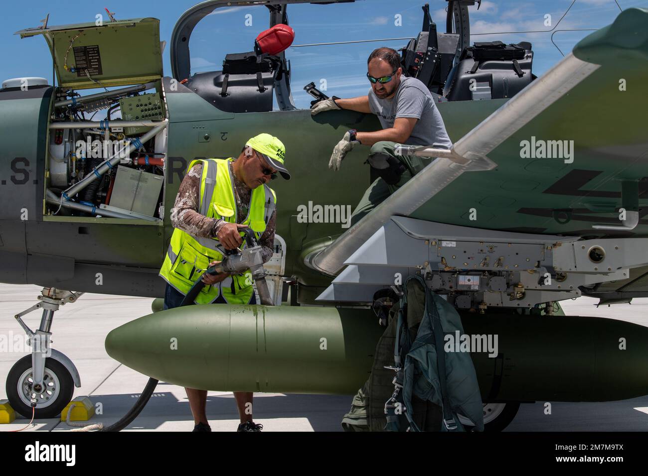 Christopher Cardona, Textron weapons loading technician, right, and ...