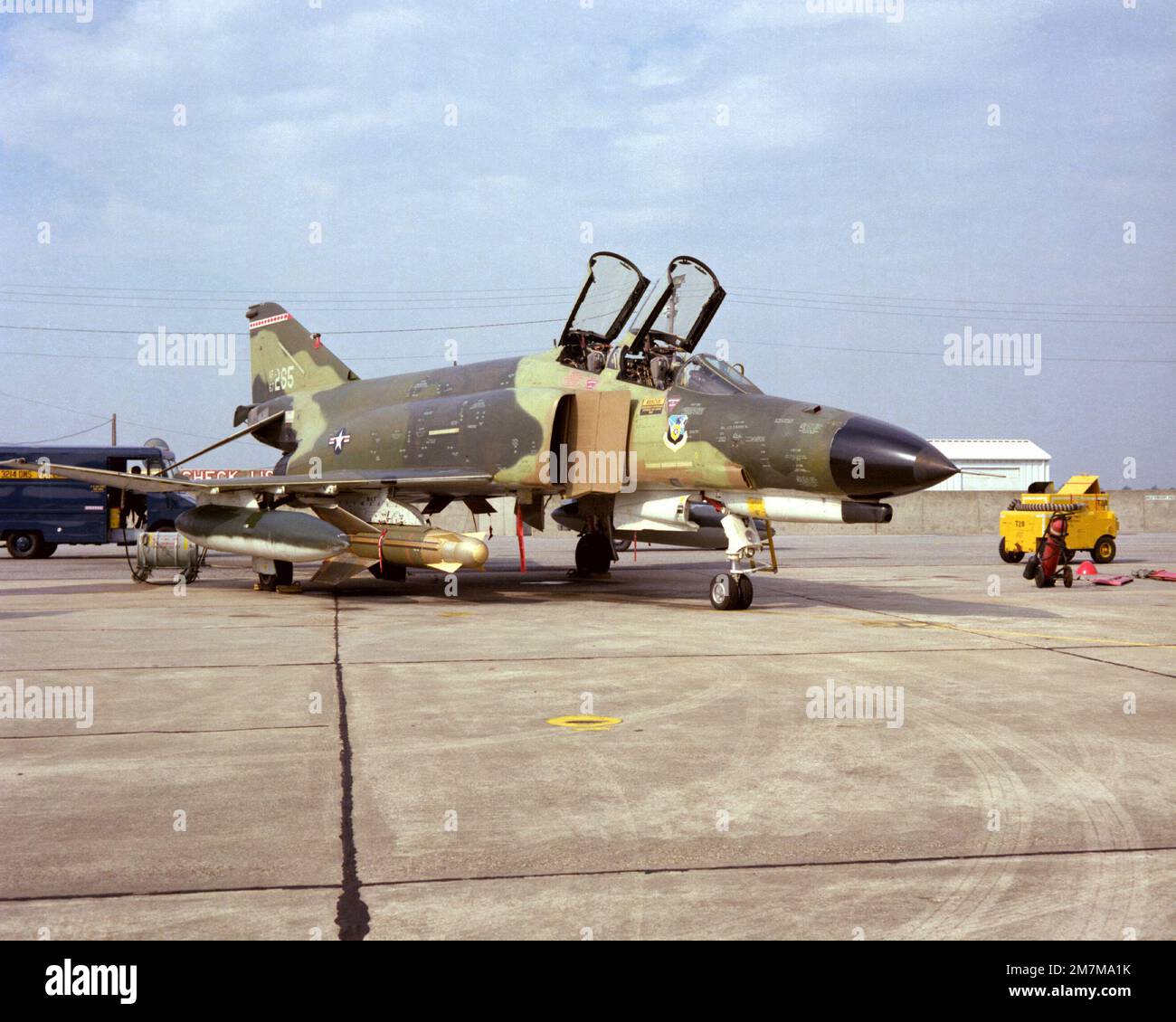 A front view of a parked F-4E Phantom II aircraft armed with a GBU-15 ...