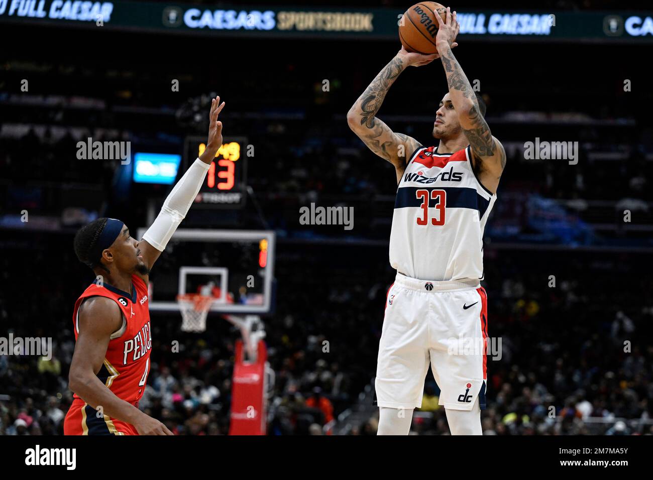 Washington Wizards forward Kyle Kuzma (33) attempts a shot against New ...