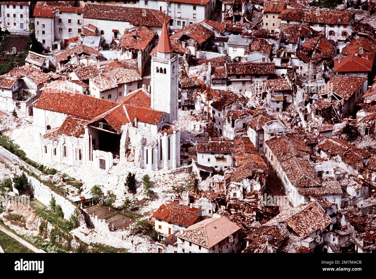 An aerial view of damage caused by a severe earthquake. Base: Gemona ...