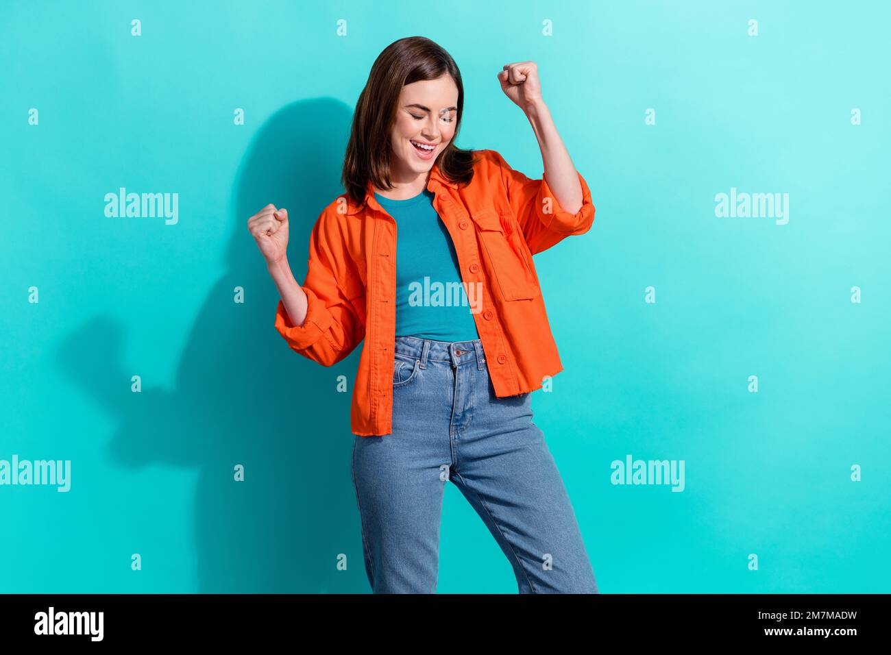 Photo of funky joyful gorgeous lady hands up rejoice low prices clothes ...