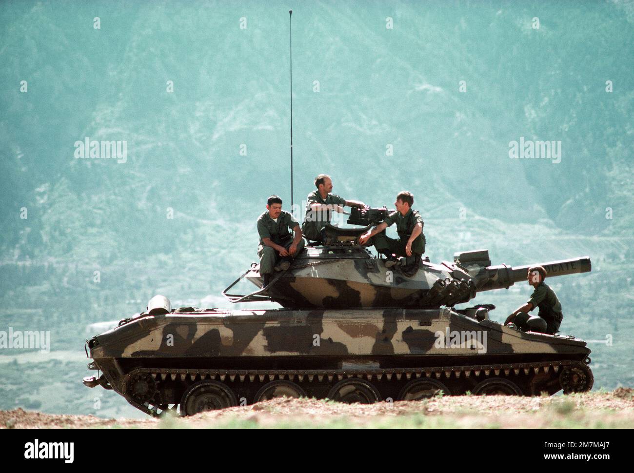 U.S. Army soldiers take a break on an M-551 armored reconnaissance ...