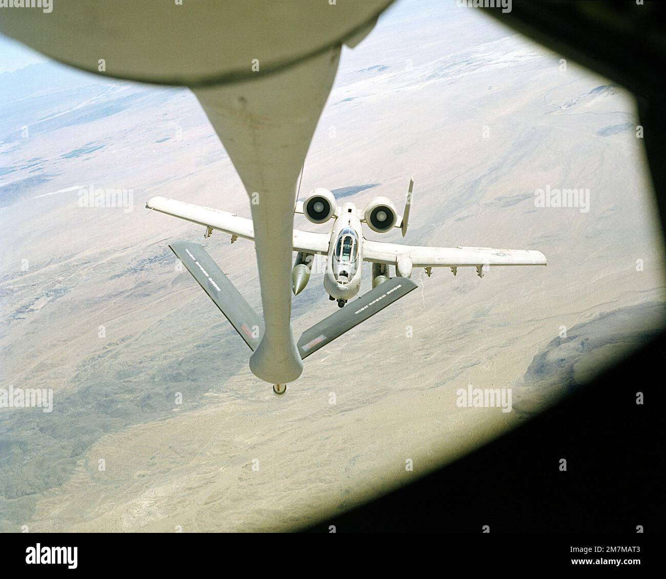 An air-to-air view from a KC-135 Stratotanker aircraft as its boom ...