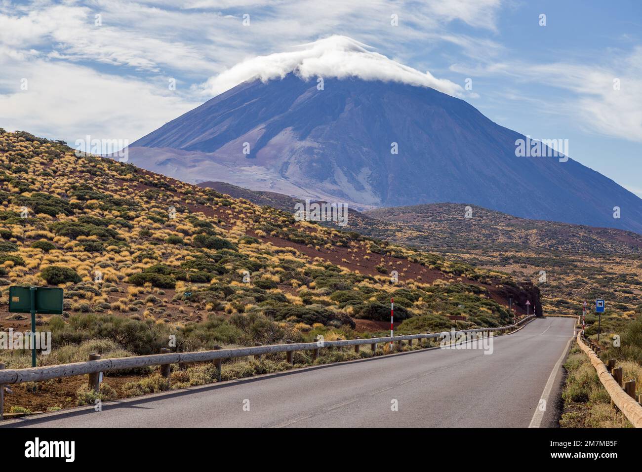 View of the mighty volcano tinted blue and purple, with a white cloud ...