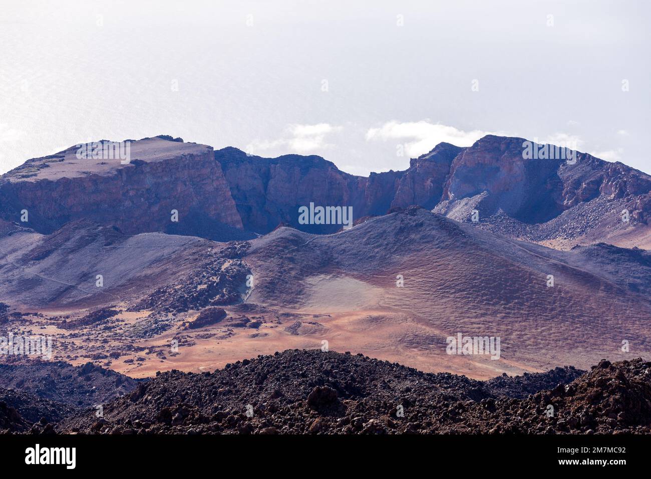 Telephoto view of the volcano caldera, tinted blue and purple in the ...