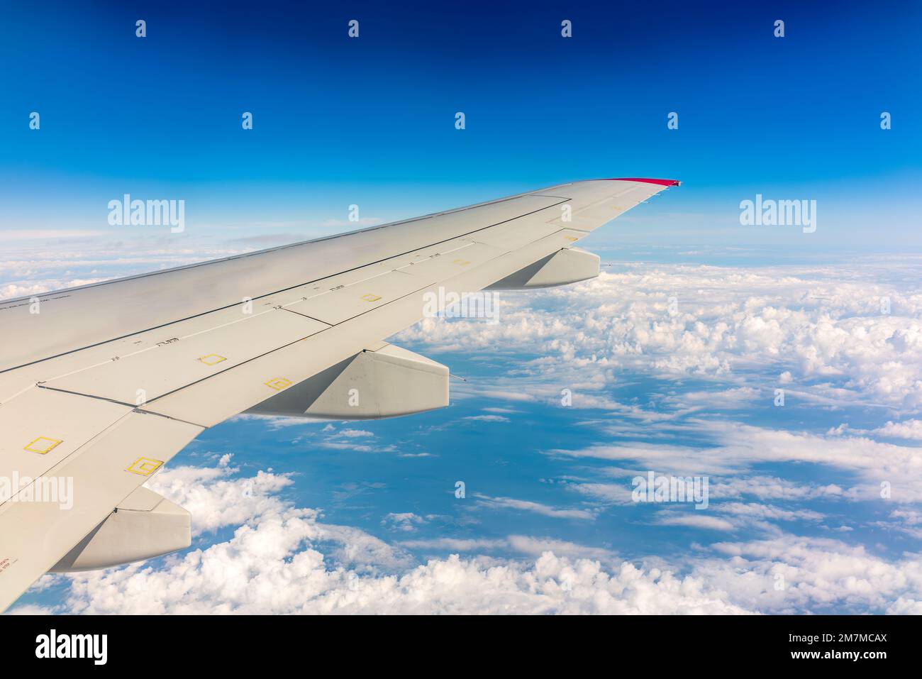 View from the airplane window at a beautiful cloudy sky and the ...