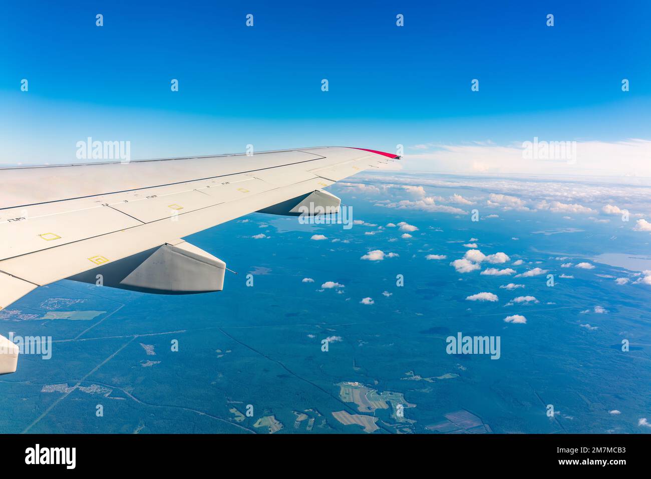 View from the airplane window at a beautiful cloudy sky and the ...