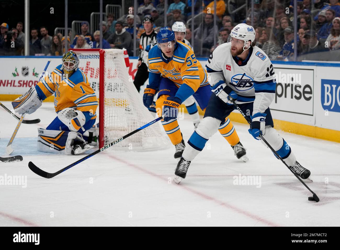 Winnipeg Jets' Jansen Harkins (12) looks to pass as St. Louis Blues ...