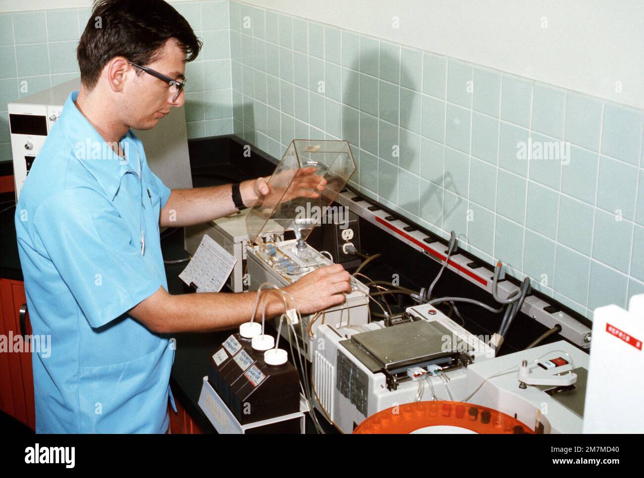 Richard F. Eveleth, a civilian laboratory technician, sets the ...