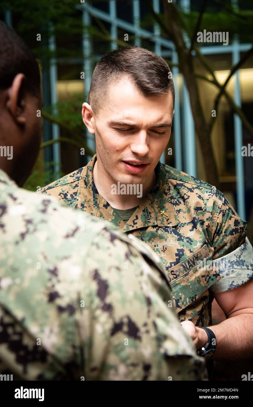 Navy Lieutenant Junior Grade Chaplain Kyle Lambertson, right, anoints ...