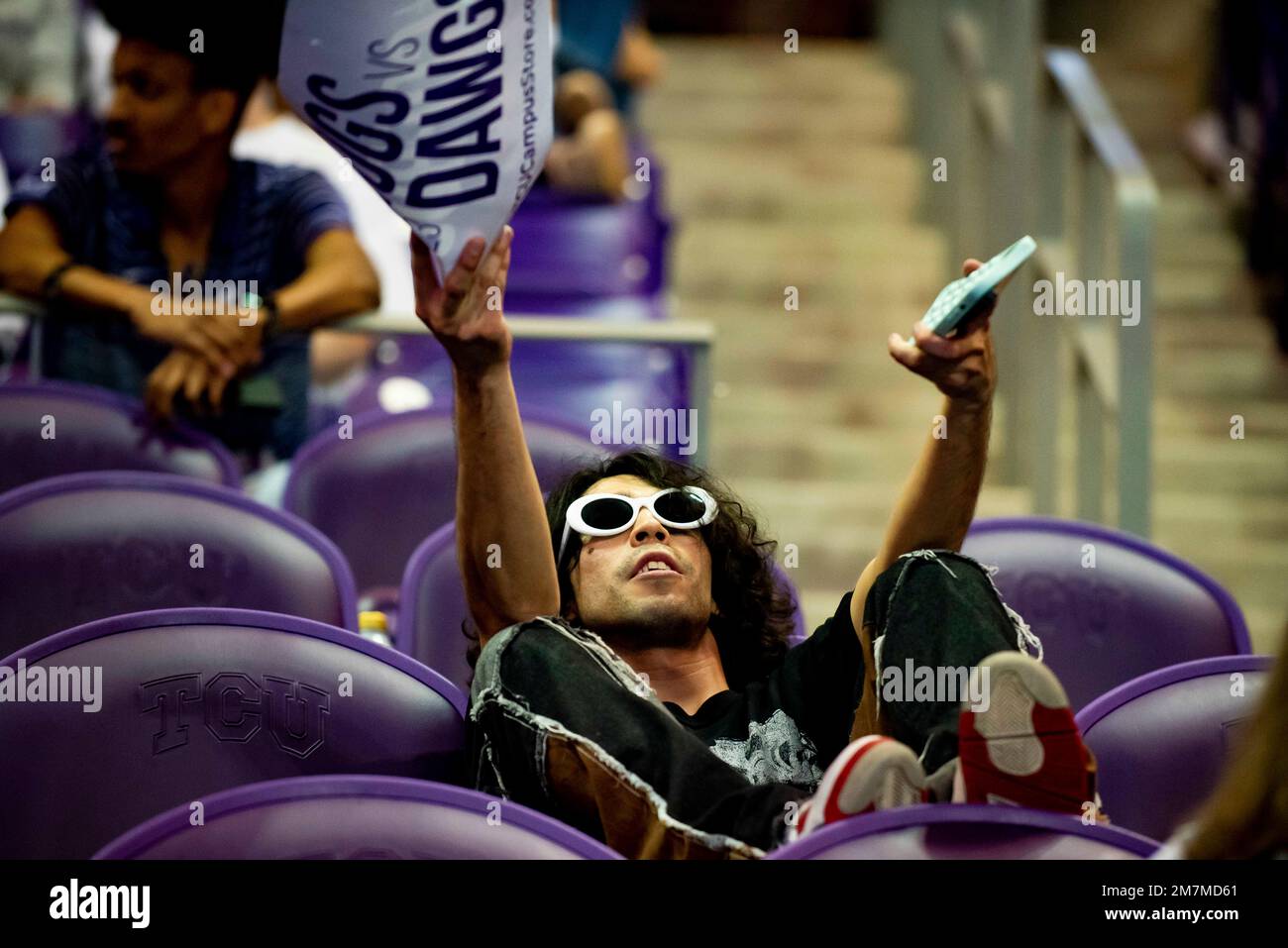 A fan reacts to a play during a watch party for the NCAA College ...