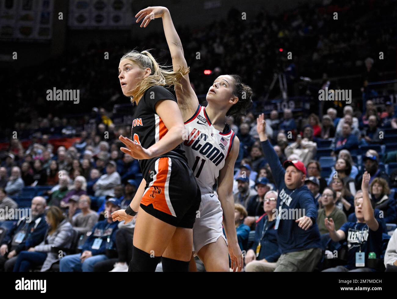 UConn's Lou Lopez-Senechal watches a 3-point shot go in, next to ...