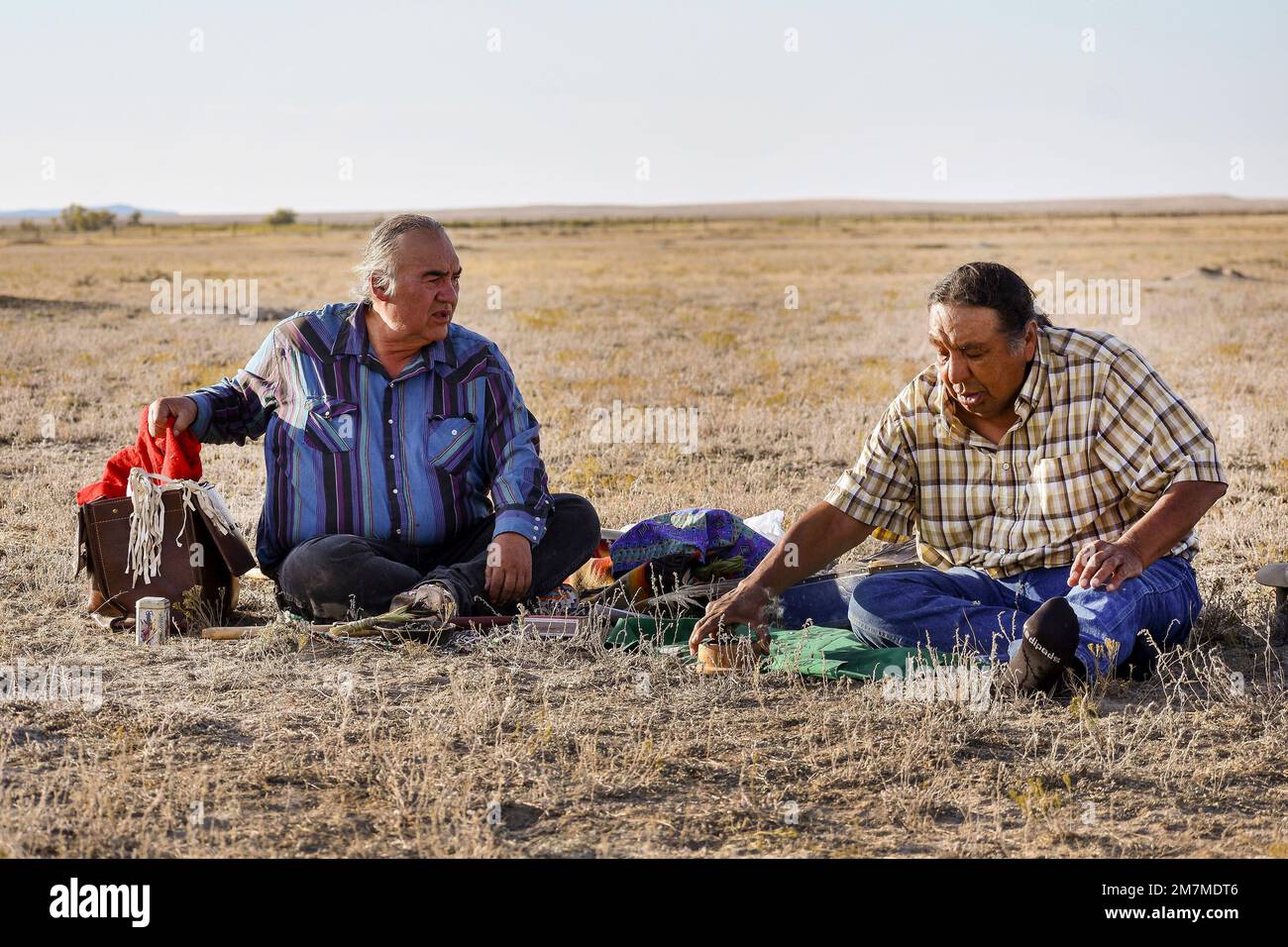 Tribal elders John Allen and Buster Moore prepare for a pipe ceremony ...