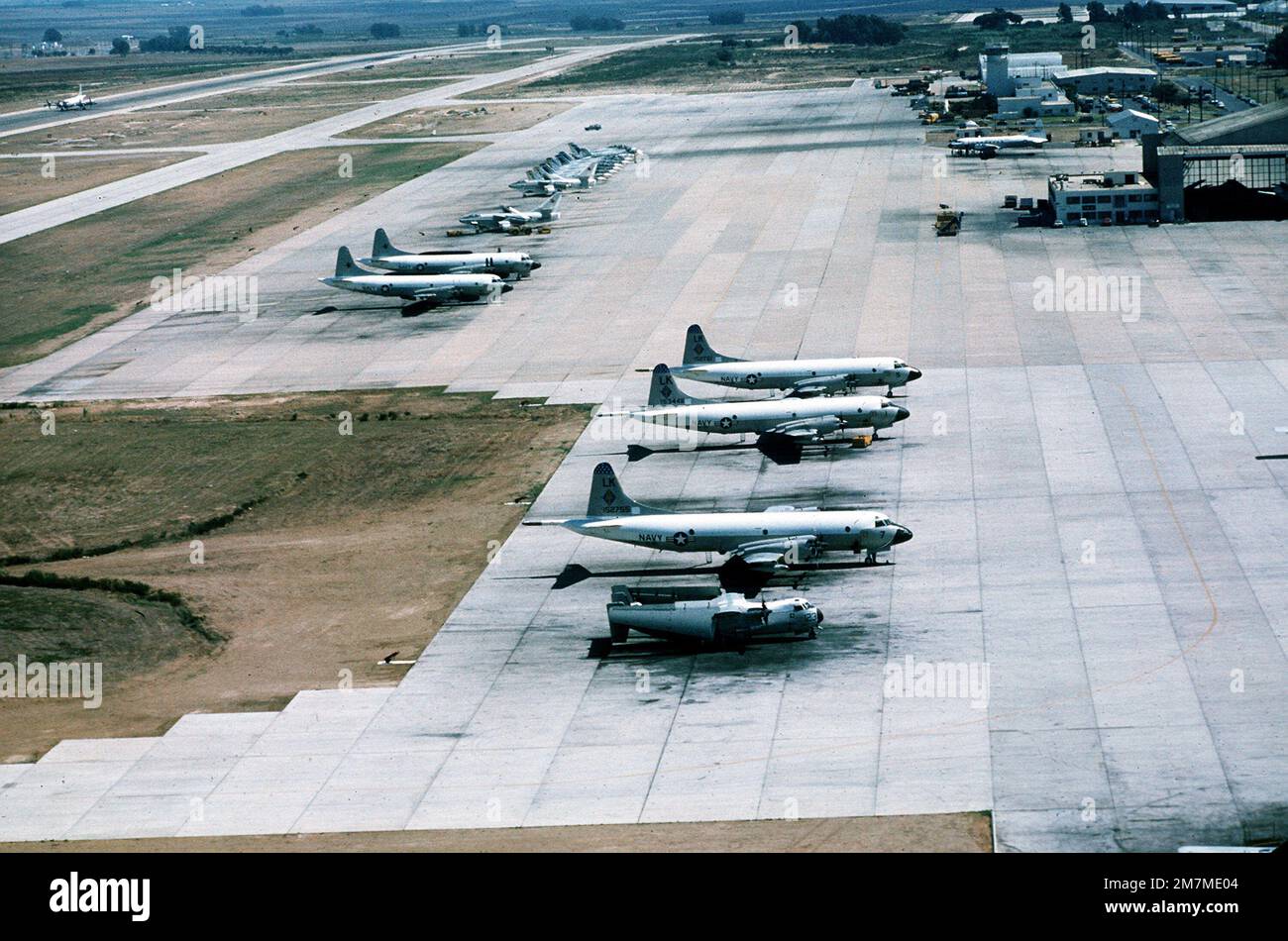 An aerial view of a U.S. Navy C-2A Greyhound, front, three P-3B Orion ...
