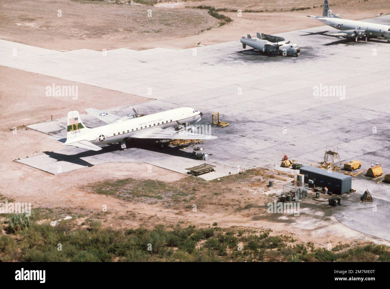An aerial view of a U.S. Navy C-118B Liftmaster, a C-2A Greyhound and a ...