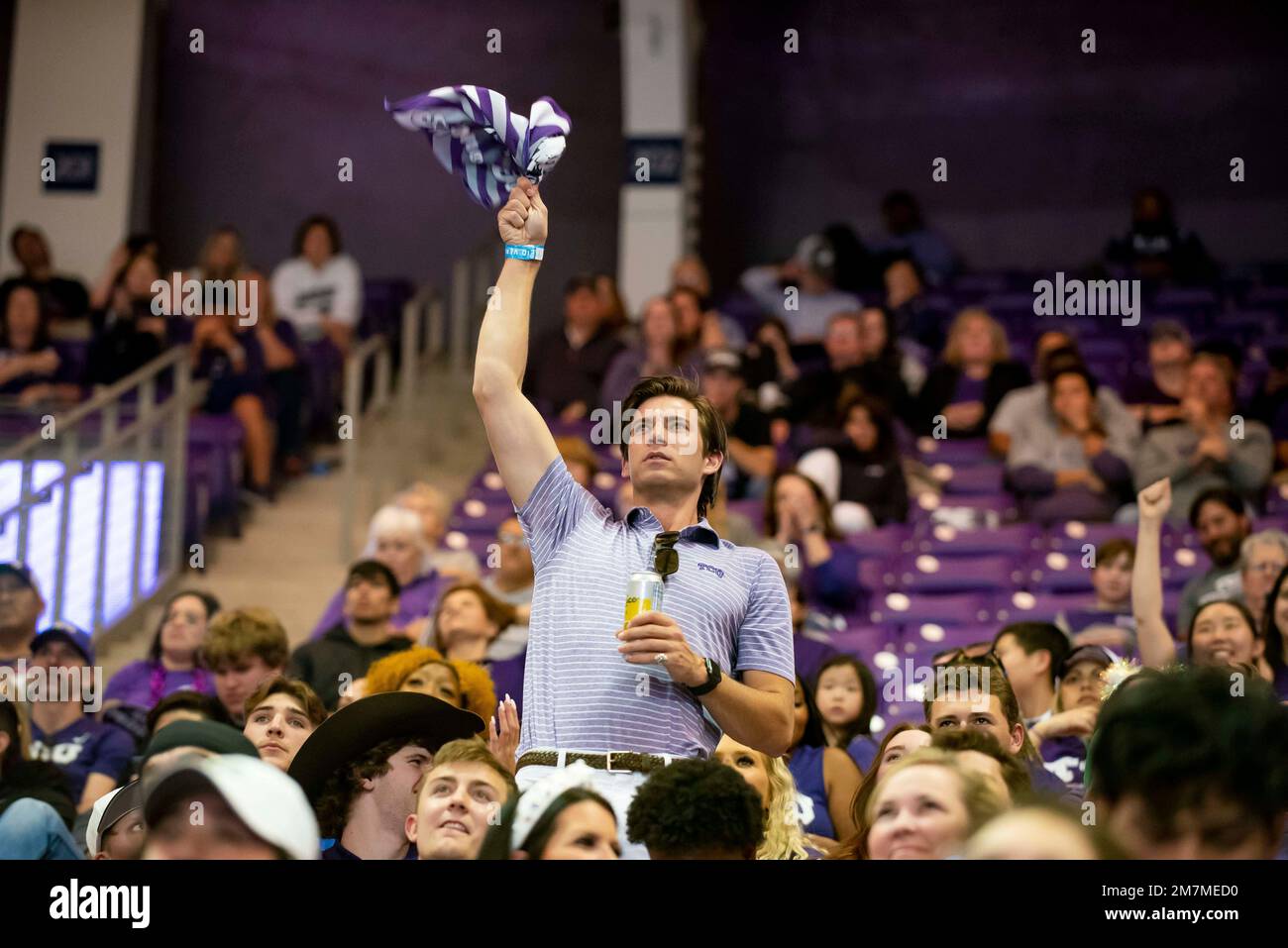 A fan cheers after TCU got a first down at a watch party during the ...