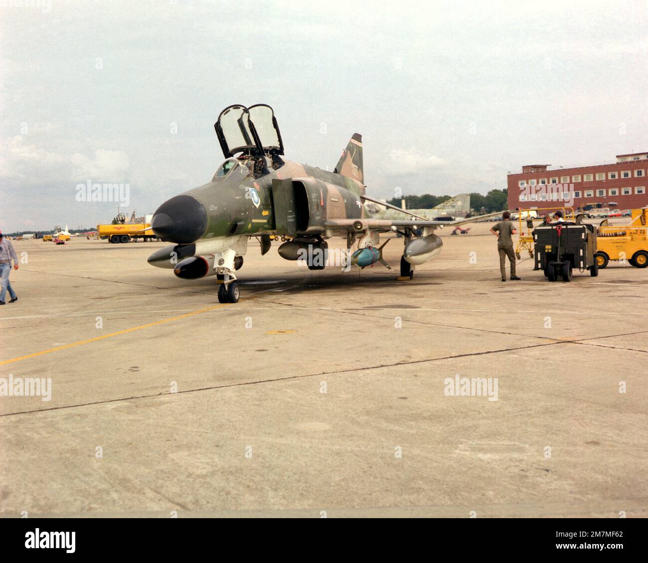 A left view of an F-4E Phantom II aircraft equipped with, left and ...