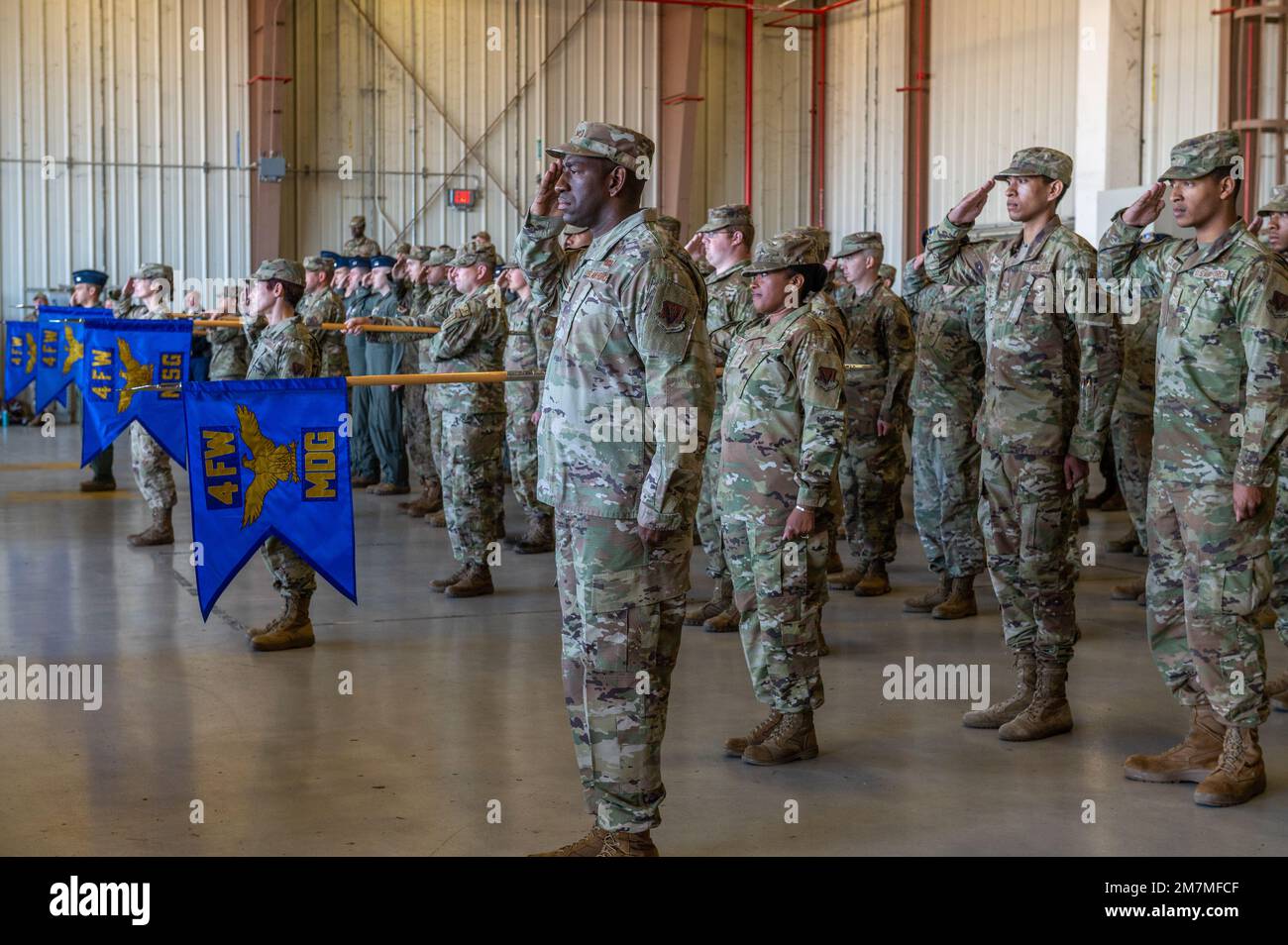 Airmen assigned to the 4th Fighter Wing salute Col. Lucas Teel, 4th FW ...