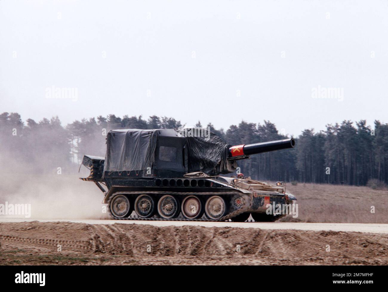 An M110 203 mm (8-inch) self-propelled howitzer moves out during a combat training exercise ...