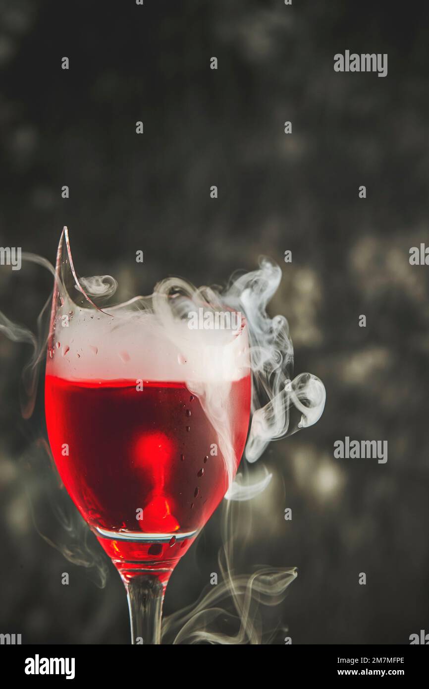 Alcohol and smoke in broken glass Stock Photo - Alamy